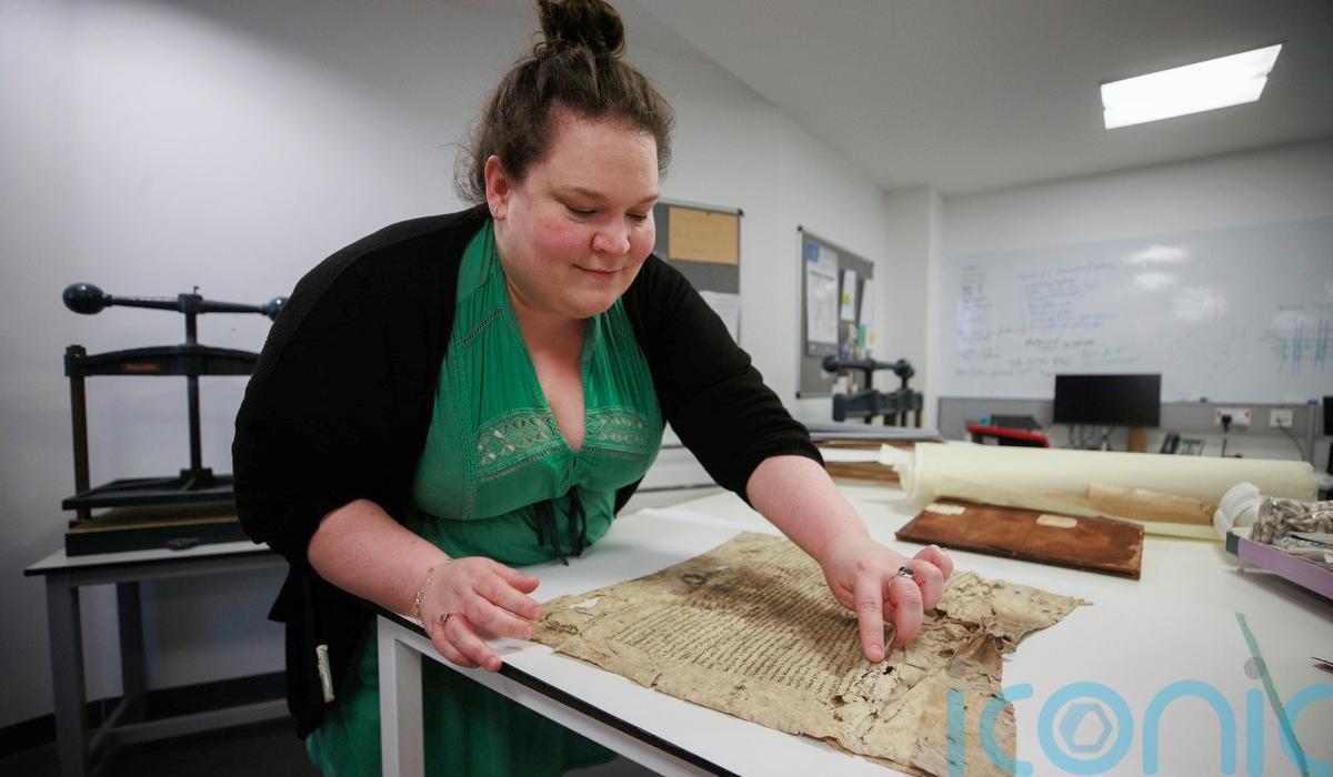 Work begins to conserve one of the oldest paper documents on island of ...