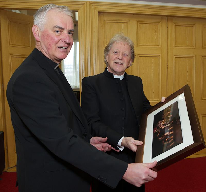 "We must hold hands not grudges," says Reverend David Latimer as he ...