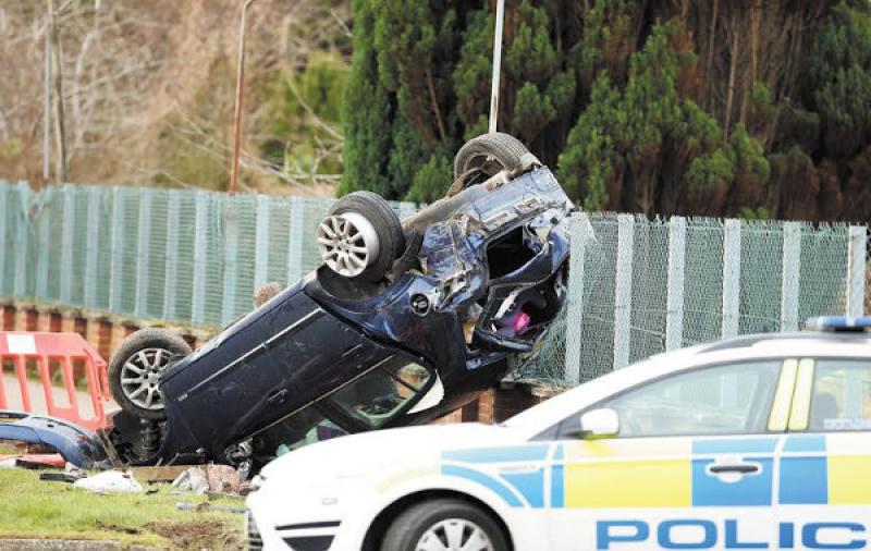 Five arrested after car crashes onto its roof - Derry Now