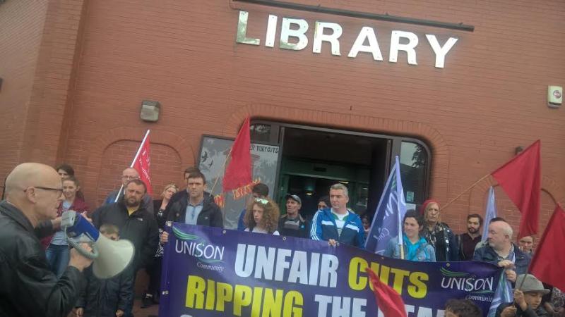 Local authors attend protest rally at plans to reduce opening hours at ...